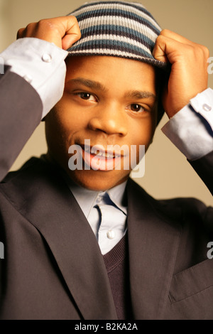 A vertical closeup shot of a man wearing a blue hijab over his head in ...