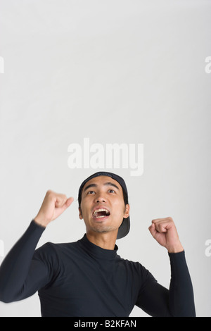 Close-up of young man shouting and looking away Stock Photo - Alamy