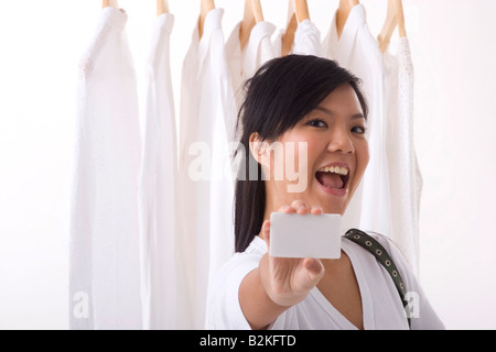 Joyful young woman showing a blank card Stock Photo - Alamy