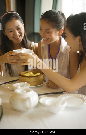 Enjoying dumplings in a restaurant with chopsticks Stock Photo - Alamy