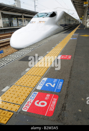 Modern technology Hikari Shinkansen bullet train waiting at Shin Osaka ...