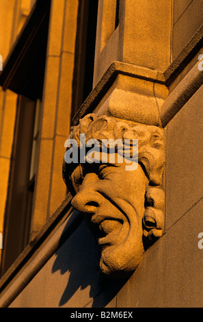 Gargoyle on side of building at sunset grotesque expression along the ...