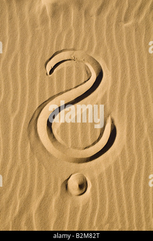 A question mark drawn in the sand from above Stock Photo - Alamy
