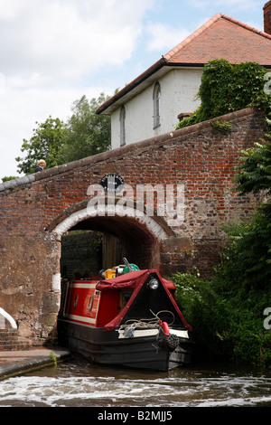canal narrowboat exiting bridge number 46 bumble hole lock on the ...