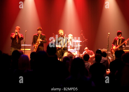 Local live rock band playing and exotic dancers performing on stage ...