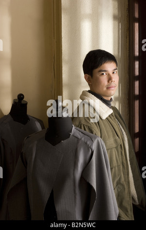 Young chinese man tailor smiling confident standing at atelier Stock ...