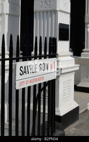 Saville Row street sign on railings outside tailors shop Mayfair London ...