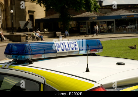Police sign with blue lights on top of a patrol vehicle Stock Photo ...