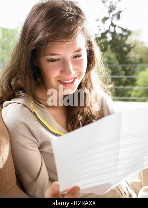 young woman reading a letter Stock Photo - Alamy