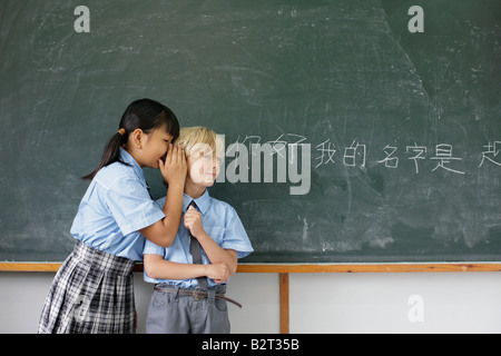Group Of Pre School Children Answering Question In Classroom Stock ...