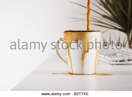 Cup of coffee overflowing Stock Photo: 20530898 - Alamy