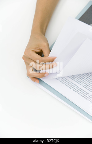 Hand turning document page, close-up Stock Photo - Alamy
