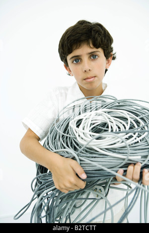 Boy holding electrical cables Stock Photo - Alamy