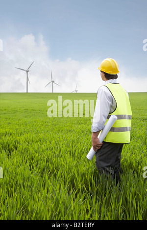 Male engineer on windmill farm for electric power production Stock ...