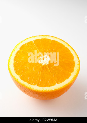 One half of fresh sweet orange on a bamboo cutting board isolated on ...