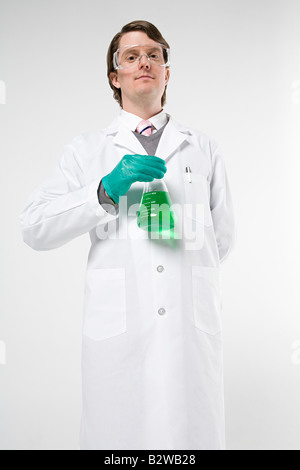 male scientist holding erlenmeyer flask partially covering his face ...