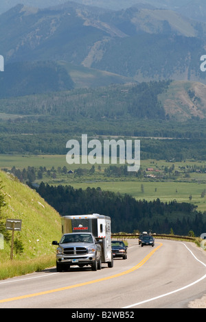 Vehicles travel over the high mountain Teton Pass on Wyoming Highway 22 ...