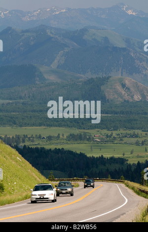 Vehicles travel over the high mountain Teton Pass on Wyoming Highway 22 ...