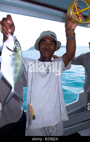 Man shows off his fish catch Stock Photo - Alamy
