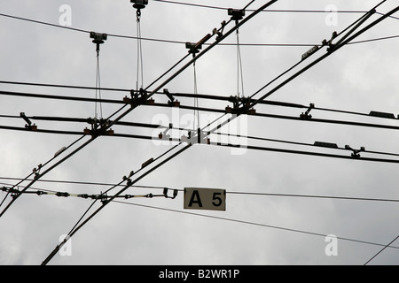 Tram overhead electrical wires in front of a building facade, Milan ...
