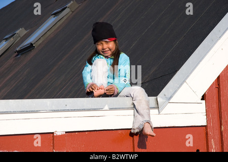 Young Inuit girl in traditional skin clothing. Grise Fjord, Nunavut ...