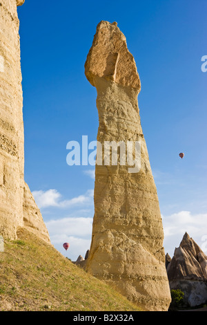 Hot air balloon over the phallic pillars known as fairy chimneys in the ...