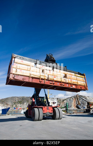 Moving freight containers around at Ilulissat dock on Greenland Stock ...
