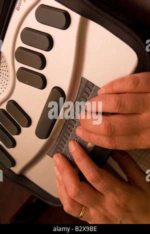 Blind woman using Braille Note machine, basically a laptop, for people ...