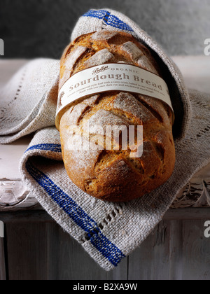 Fresh rustic sourdough loaves on a wooden shelf. High quality photo ...
