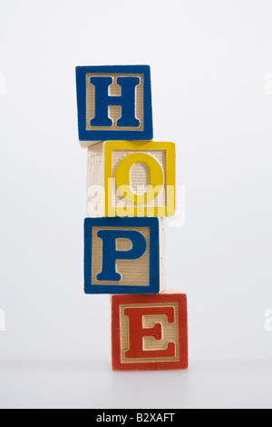 Alphabet Blocks spelling the words hope Stock Photo - Alamy