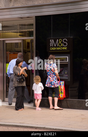 SHOPPERS WITHDRAW MONEY AT ATM MACHINE AT ASDA 24 HOUR SUPERMARKET IN ...