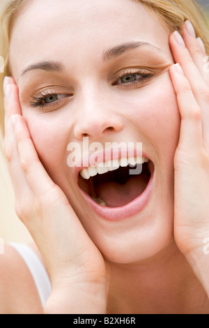 Beautiful shocked young woman in sunglasses with tasty strawberry ...