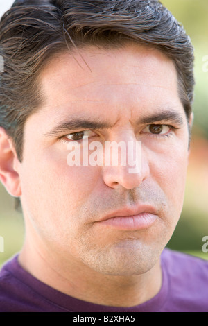 Portrait of a man looking angry Stock Photo - Alamy