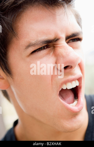 Man scowling at camera, head and shoulders, portrait Stock Photo - Alamy