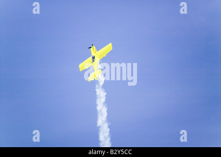 Stunt pilot Rob Harrison flying the Zlin, a bright yellow aircraft ...