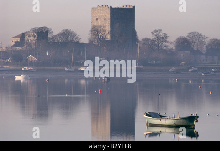 The Norman keep of Portchester Castle seen at sunset in winter from ...