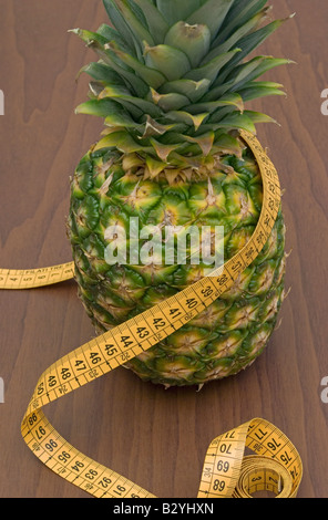 Diet concept. Measuring tape on wooden background with book diary ...