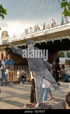 Street performer on the South Bank blowing bubbles for children. London ...
