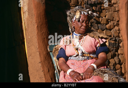 Sangoma (traditional healer) sitting in front of house, Lesotho, Africa Stock Photo - Alamy