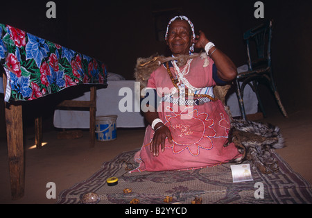 Sangoma (traditional healer) sitting in front of house, Lesotho, Africa Stock Photo - Alamy