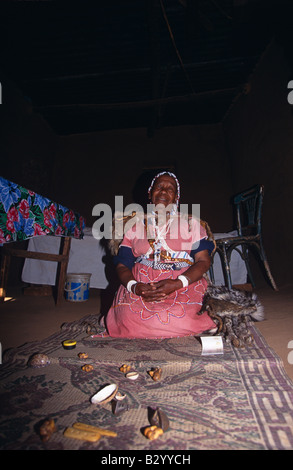 Sangoma (traditional healer) sitting in front of house, Lesotho, Africa Stock Photo - Alamy
