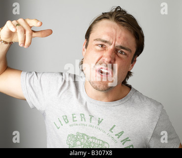 Angry and mean looking man pointing with finger Stock Photo - Alamy