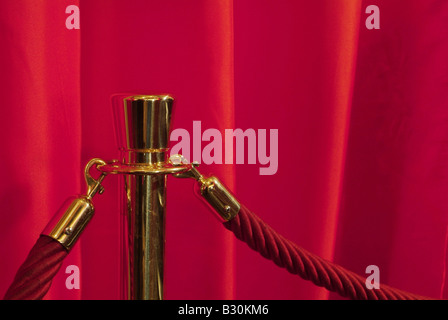 Red cords on a gilded pole Stock Photo - Alamy