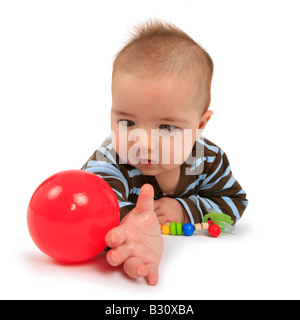 baby trying to grab a ball Stock Photo - Alamy