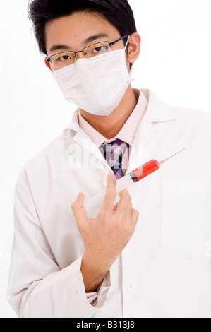 Young Asian doctor holding human skeleton model presenting medical ...