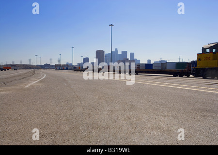 Vehicle hauling container at terminal Stock Photo - Alamy