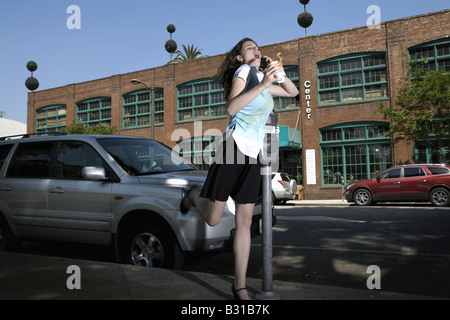 Young woman tripping up with cup of coffee Stock Photo - Alamy
