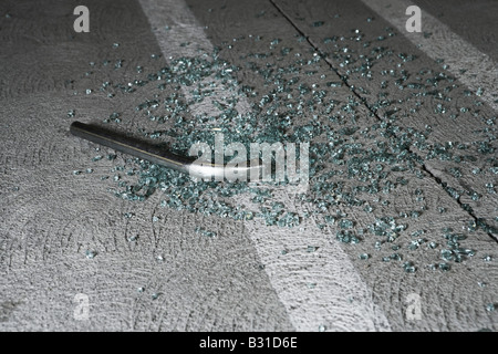 Crowbar and broken glass in car park Stock Photo - Alamy