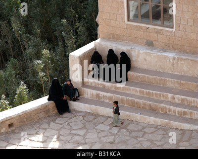 Muslim women with traditional clothes (niqab hijab) in a street of ...