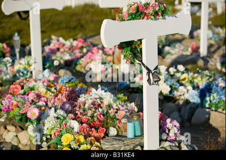 An Inuit burial graveyard at Ilulissat on Greenland with ice bergs from ...